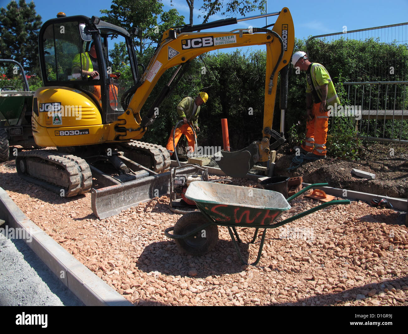 Roadworks repairs repairing highway maintenance on urban footway road ...