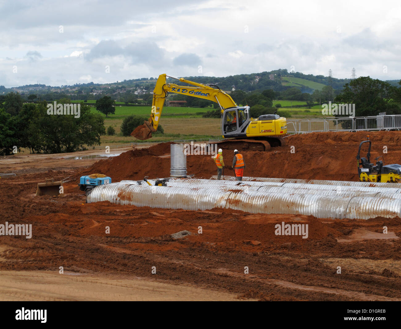 Flood prevention large pipes used to construct a holding tank to slow ...