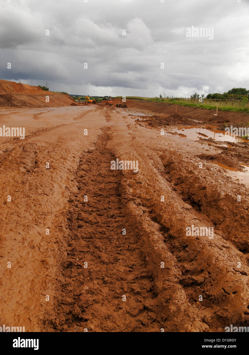tracks in gloopy thick wet mud on the site of earthworks for ...