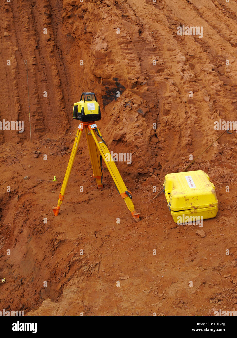 Tripod mounted self leveling rotating laser level for setting out work ...