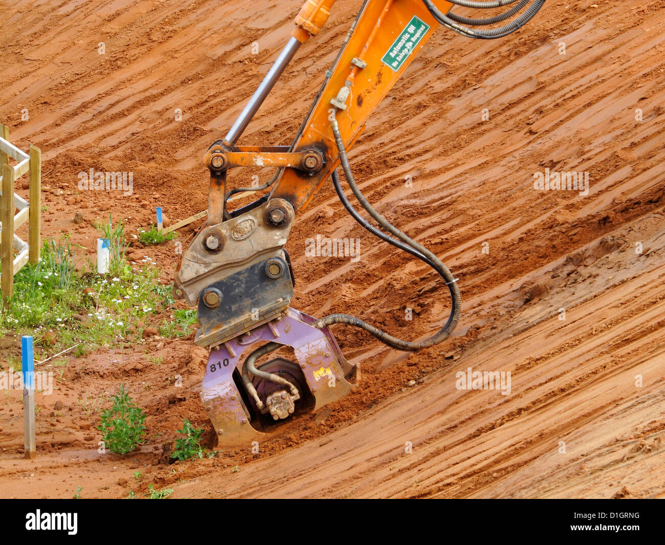 Excavator mounted hydraulic vibrating plate compacter compacting ...