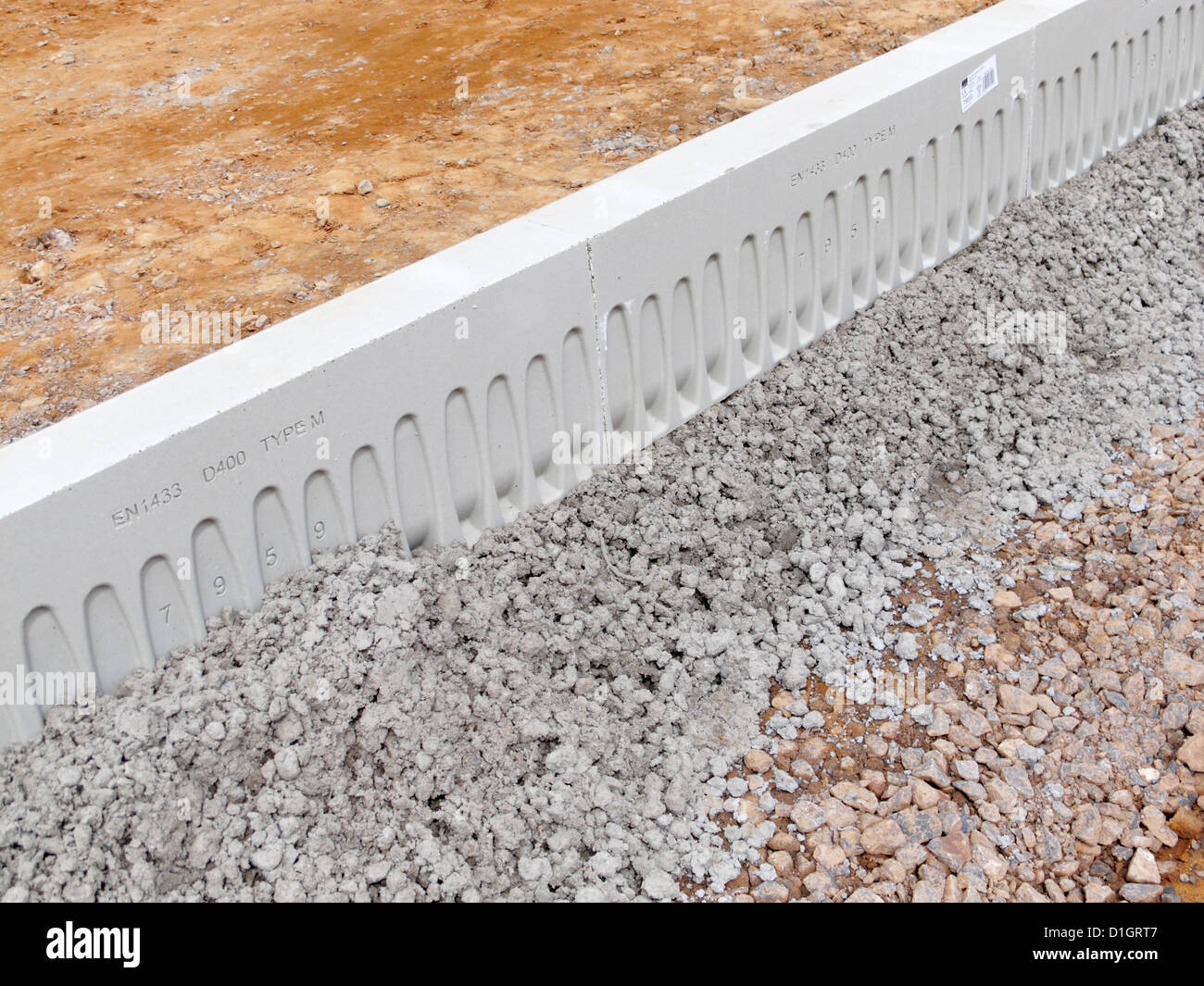 Road construction site closeup detail ACO drainage kerbs and gullies ...