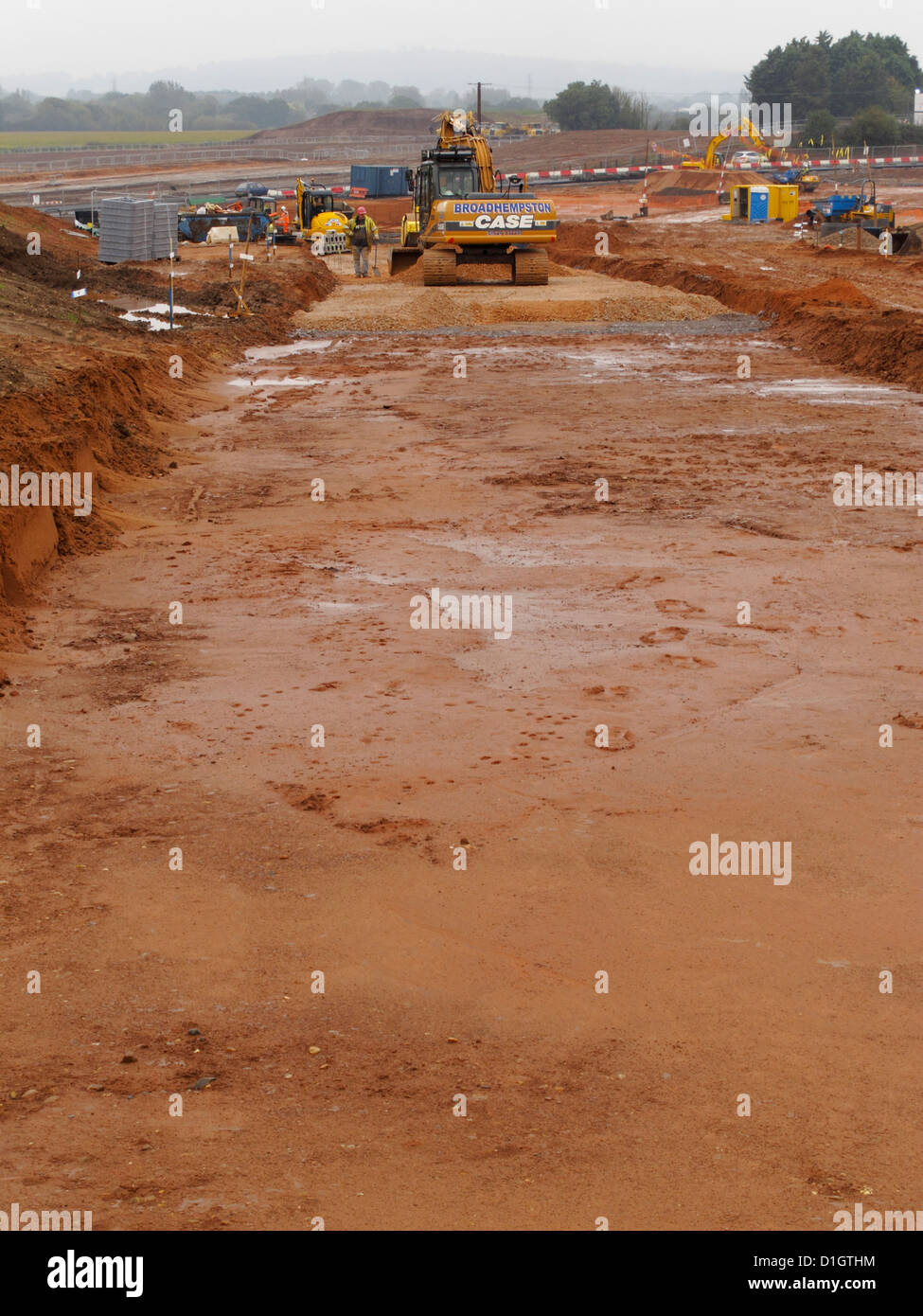 Highway construction site earthworks phase digger Stock Photo - Alamy