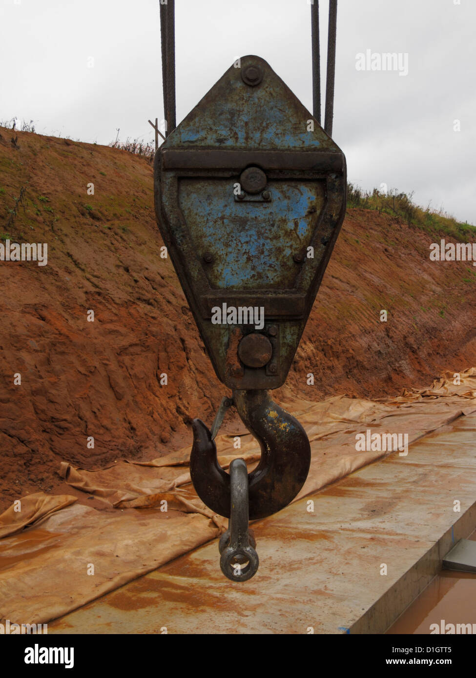 Lifting hook and shackle on a large crane jib on a uk road construction ...