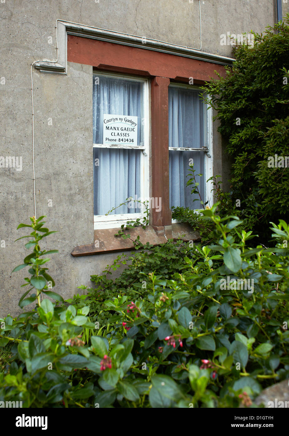 Manx Gaelic classes sign in window of house, Isle of Man Stock Photo ...