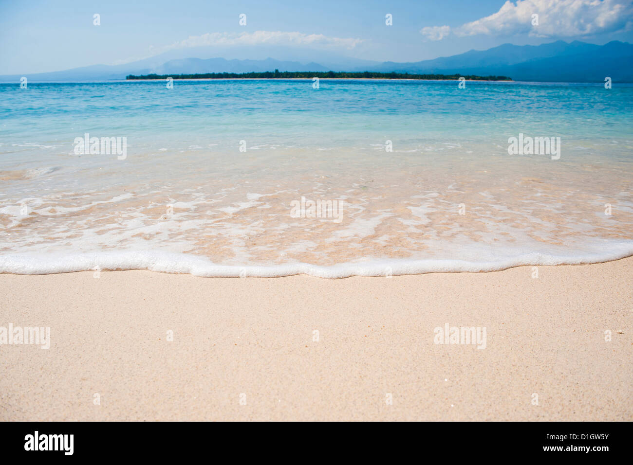 The tropical island of Gili Air, with Gili Meno beach in the foreground ...