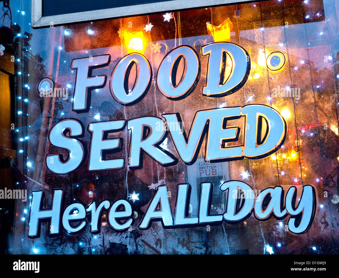 Winter sign on typical British pub window advertising food all day ...