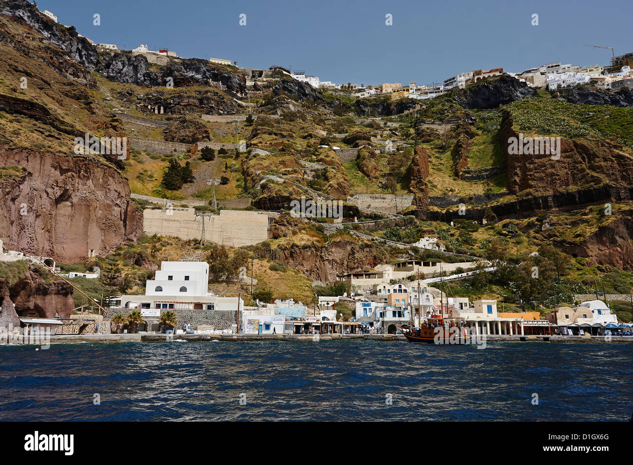 View of the port of Fira and the city on top of cliff from the Aegean ...