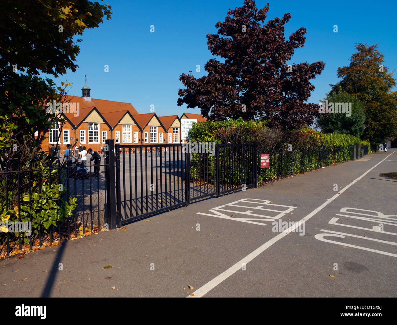 School Gate and Playground at First and Middle School Stock Photo - Alamy