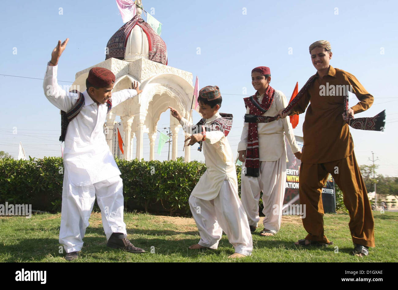 Youths wearing Sindhi traditional dresses dancing on traditional folk ...