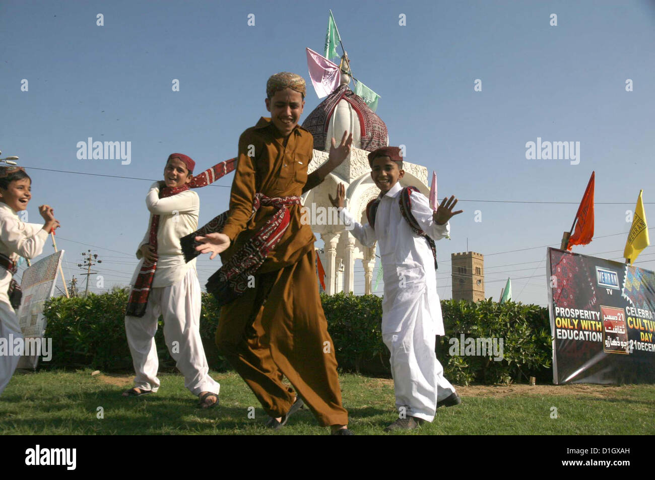Youths wearing Sindhi traditional dresses dancing on traditional folk ...
