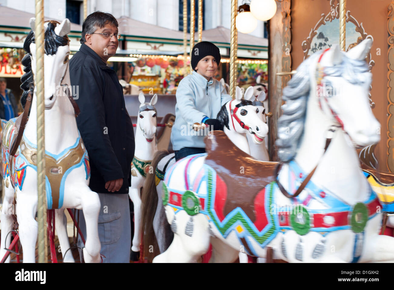 Men ride carousel hi-res stock photography and images - Alamy