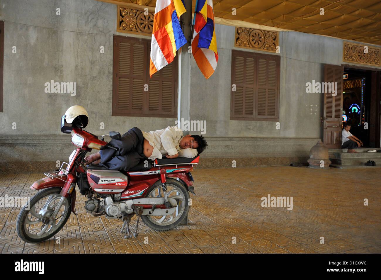 Sleeping on a motorbike hi-res stock photography and images - Alamy
