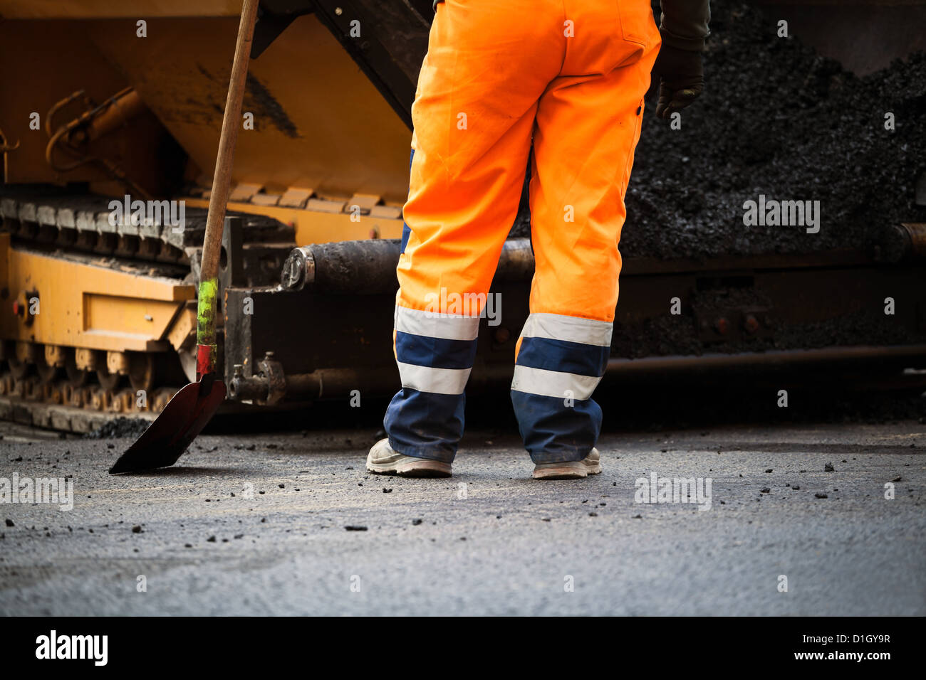 Workers on a road construction, industry and teamwork Stock Photo - Alamy