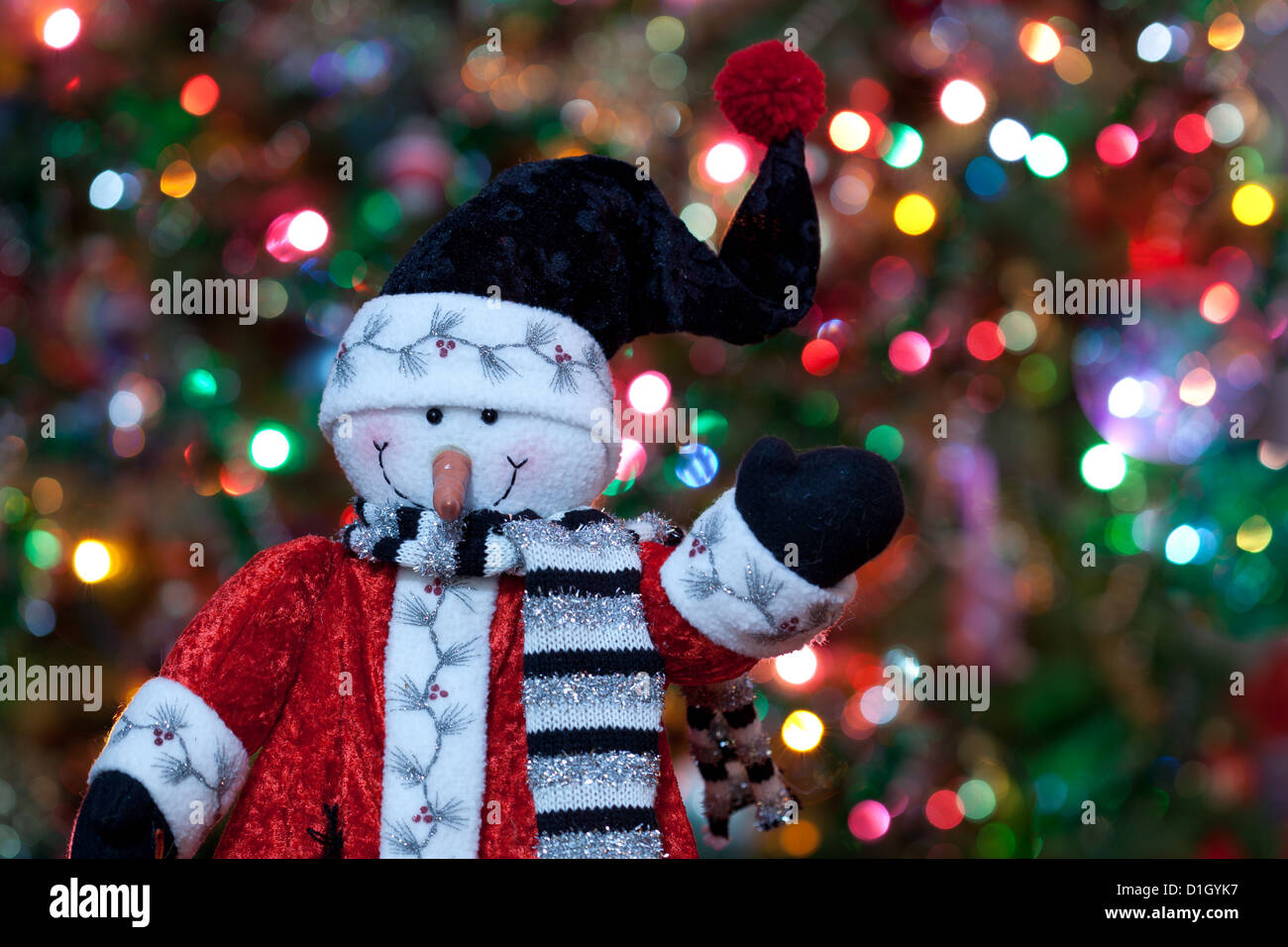 Snowman Waving his hand and Christmas lights Stock Photo - Alamy
