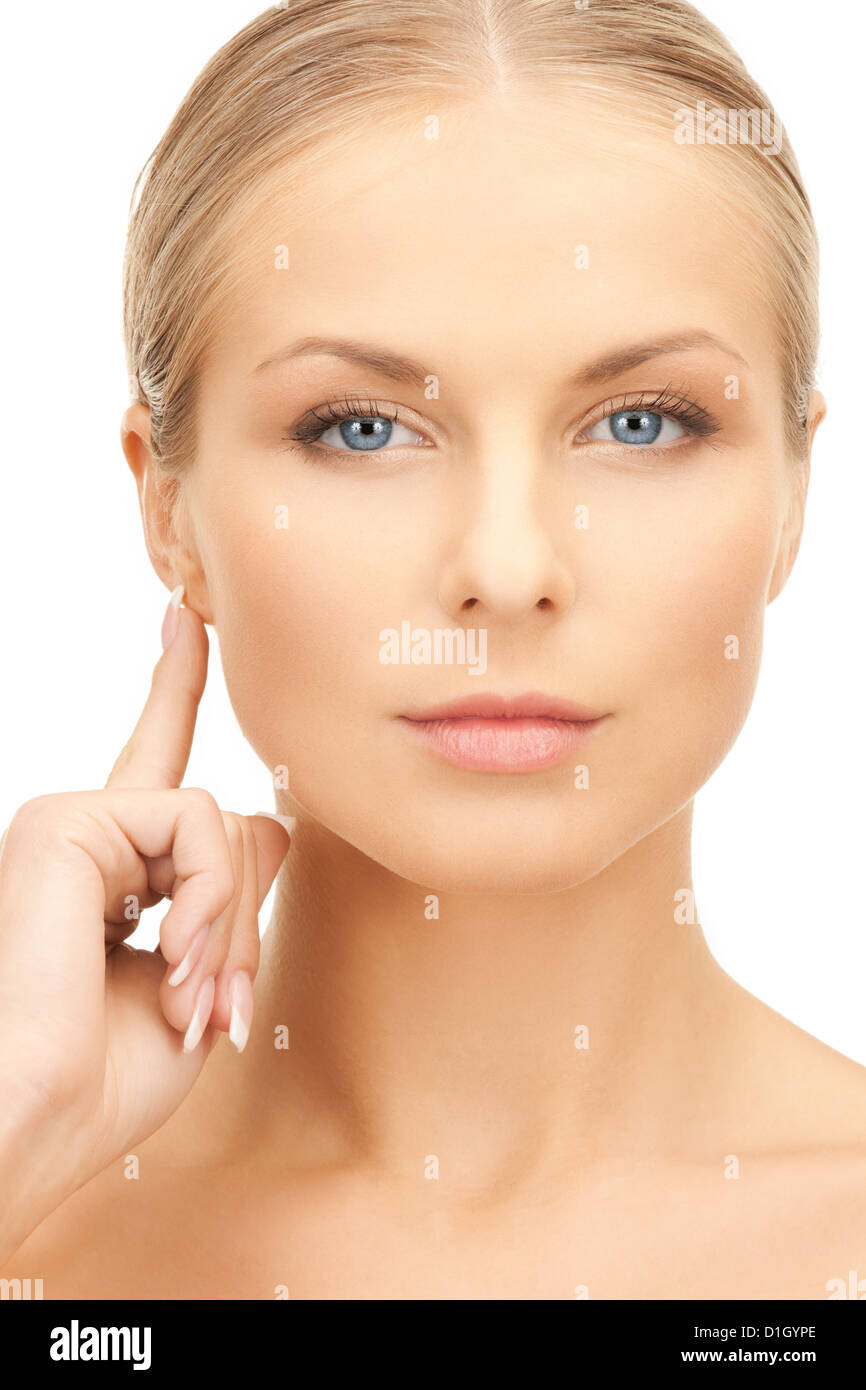 woman pointing to ear Stock Photo - Alamy
