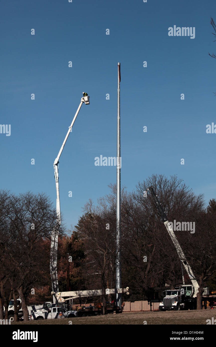 Construction of an overhead power pole line. Man in bucket lift Stock ...