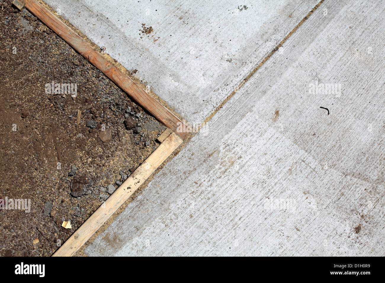 New, and dry, concrete surface inside corner, showing form board at ...