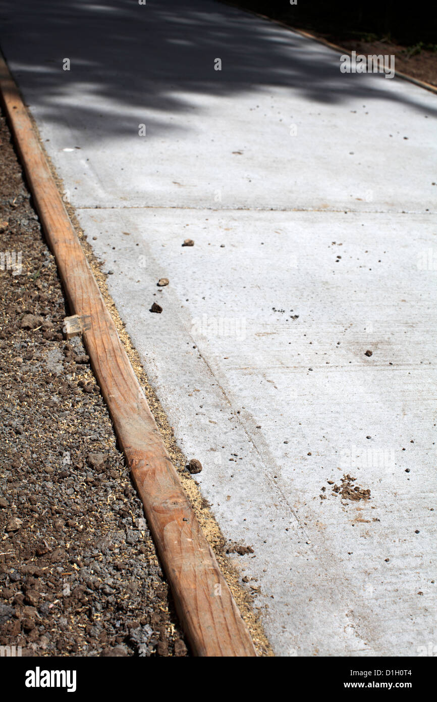 New, and dry, concrete surface, showing form board at edge Stock Photo ...