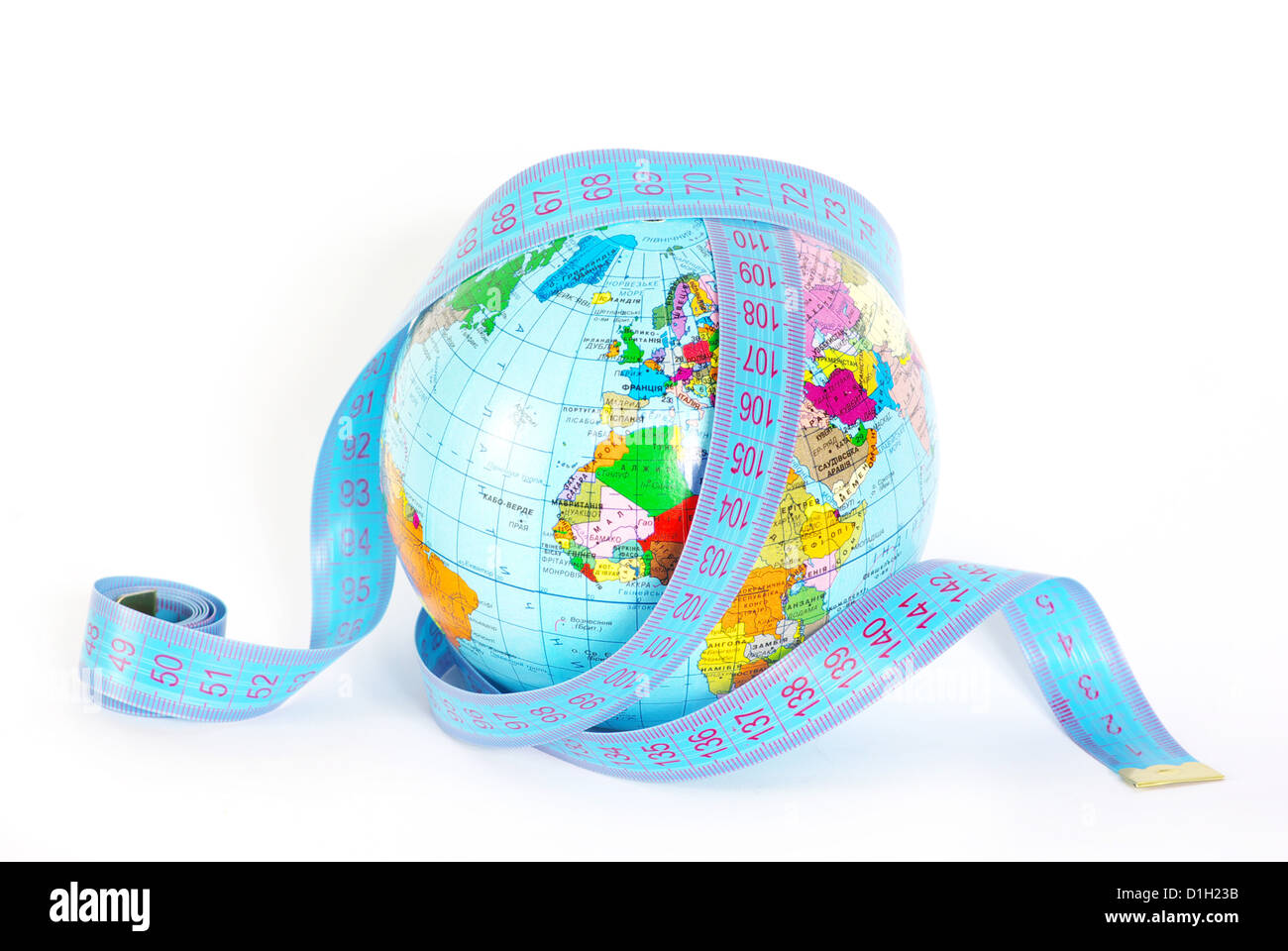 Measuring tape stretched across globe on white Stock Photo - Alamy