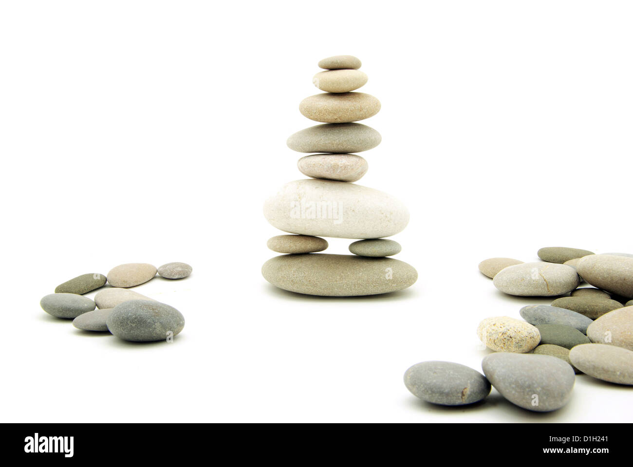 Stack of balanced stones on a white background Stock Photo - Alamy