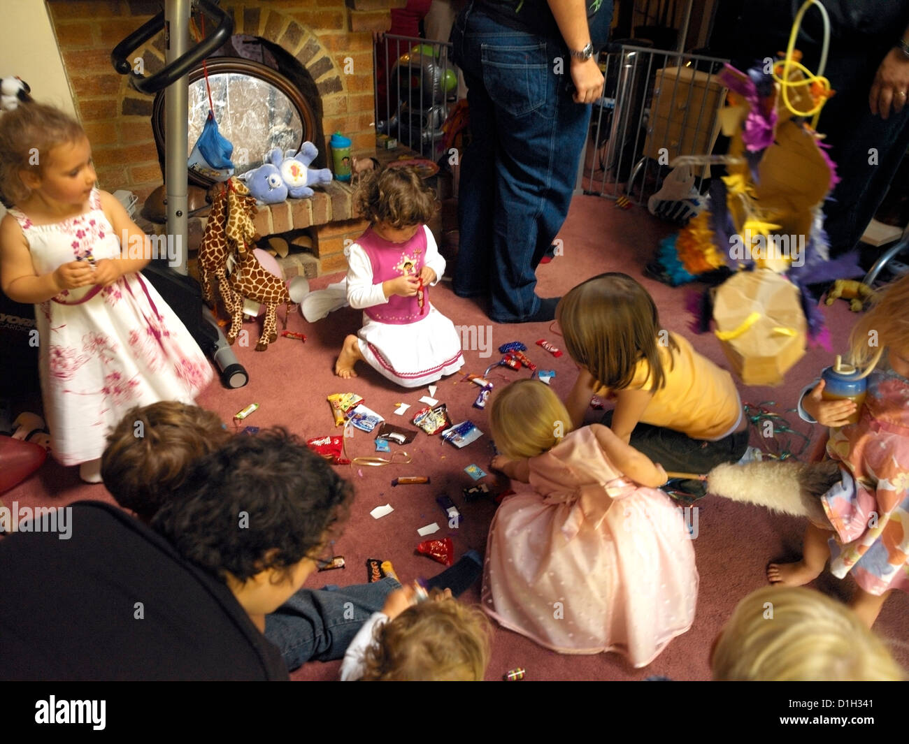 Children Picking up Sweets from the Pinata at Birthday Party in England ...
