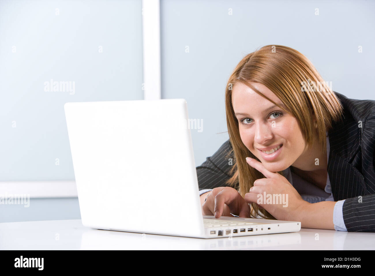 Business woman laptop in modern office Stock Photo - Alamy
