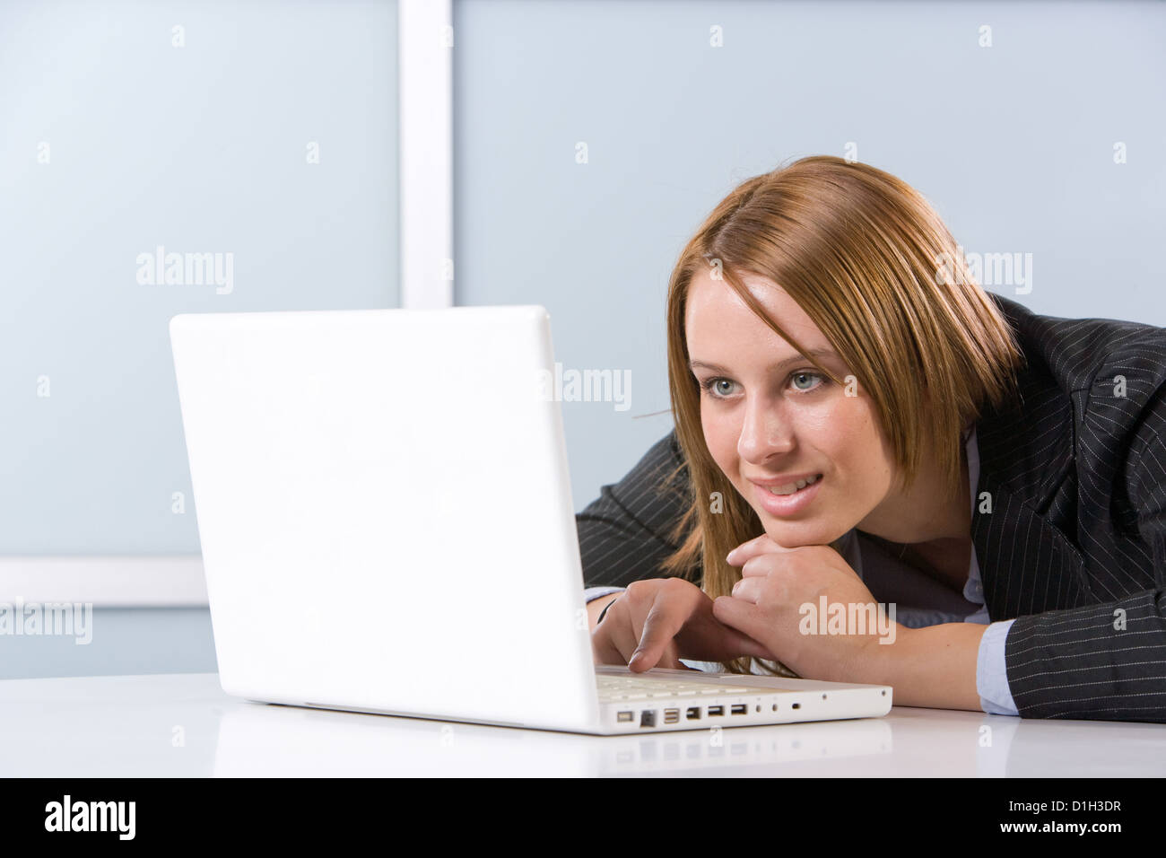 Business woman laptop in modern office Stock Photo - Alamy