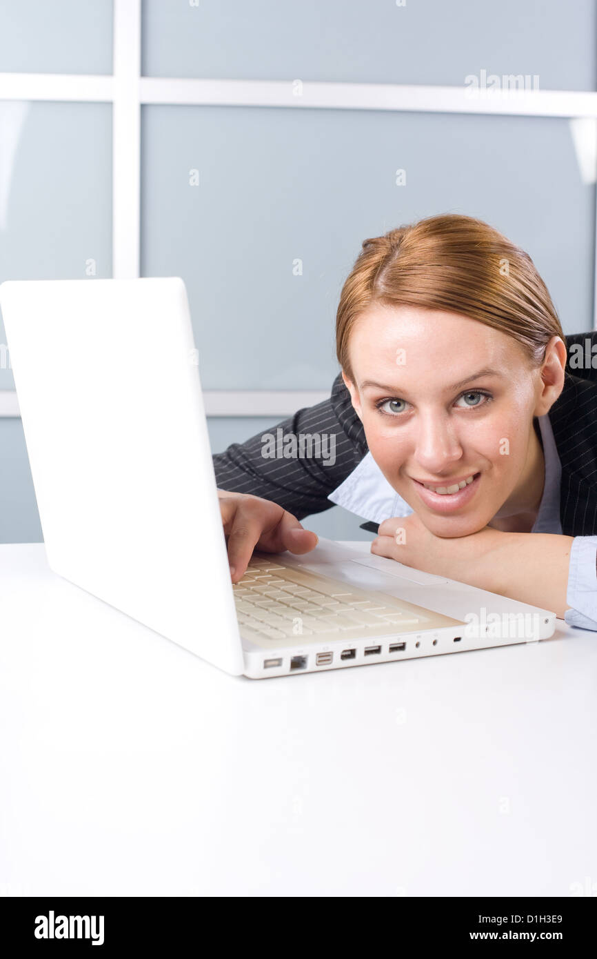 Business woman laptop in modern office Stock Photo - Alamy