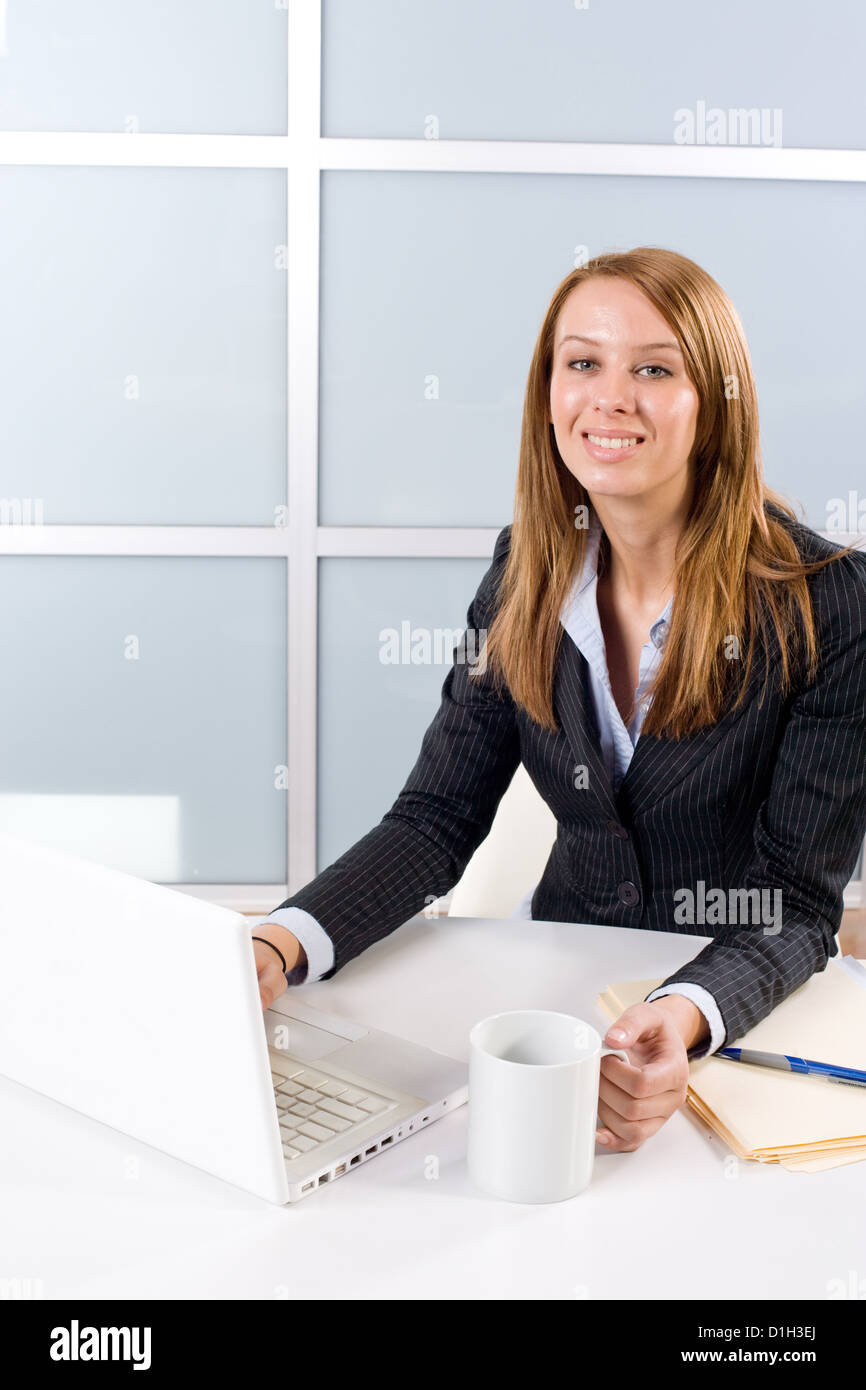 Business woman laptop in modern office Stock Photo - Alamy