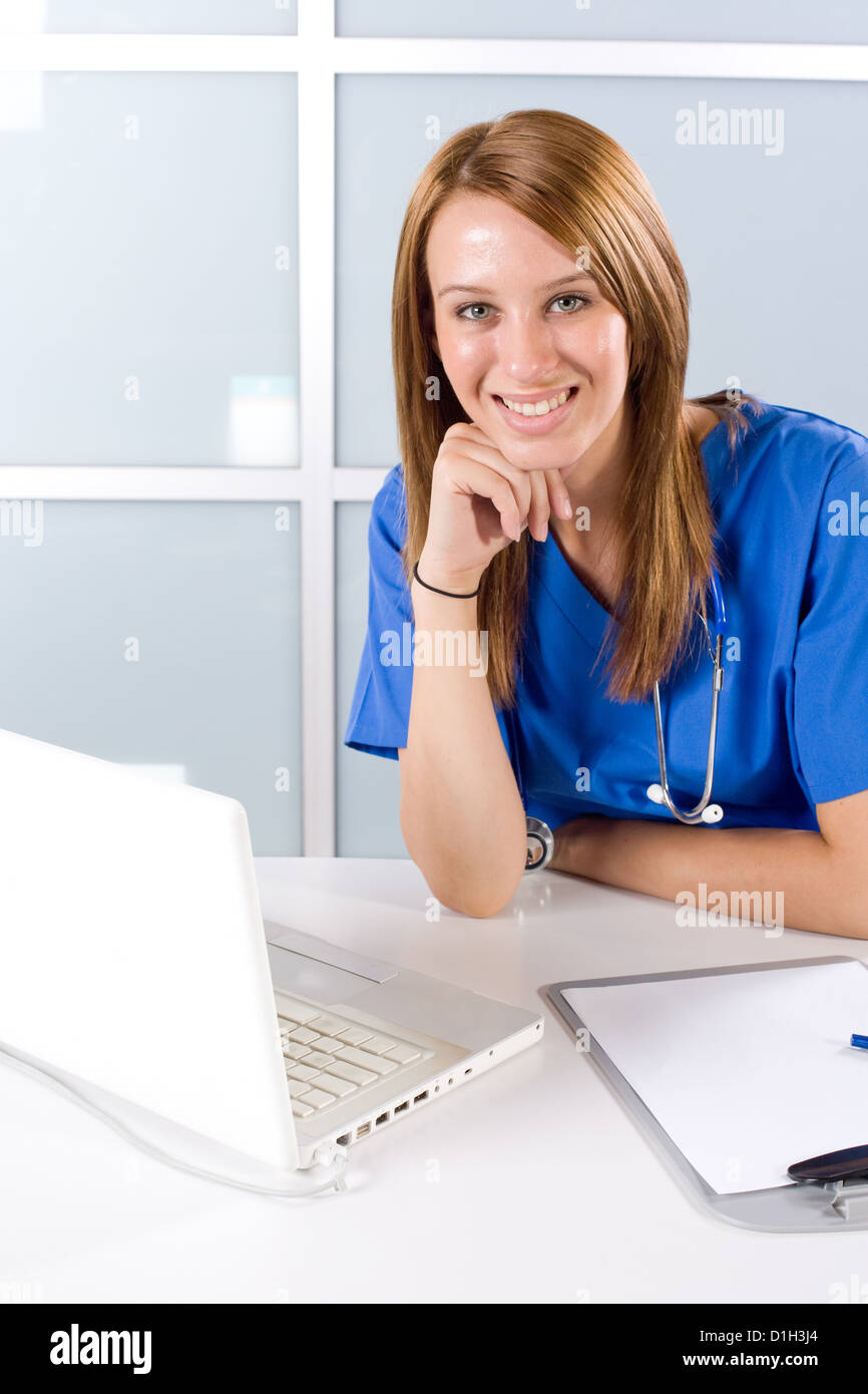 Nurse thinking in a modern office at desk Stock Photo - Alamy