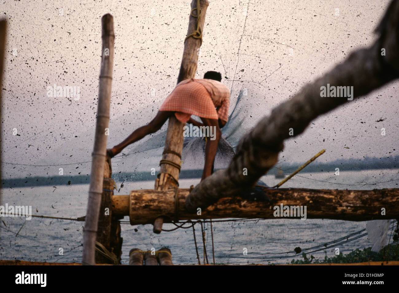 A fisherman manually operate gigantic 10-meter-high lift nets named ...