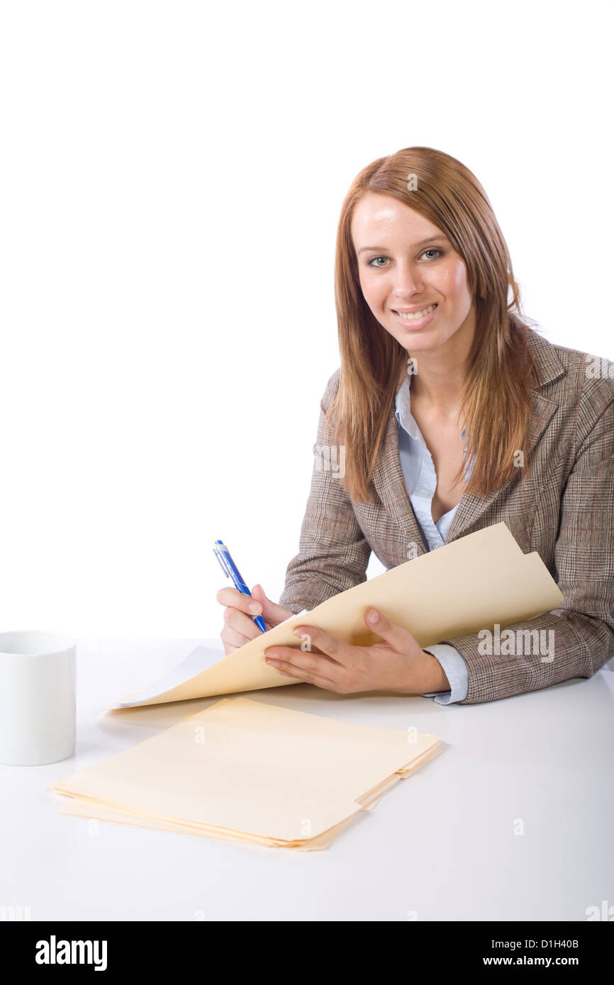Business Woman Writing notes at desk isolated on white Stock Photo - Alamy