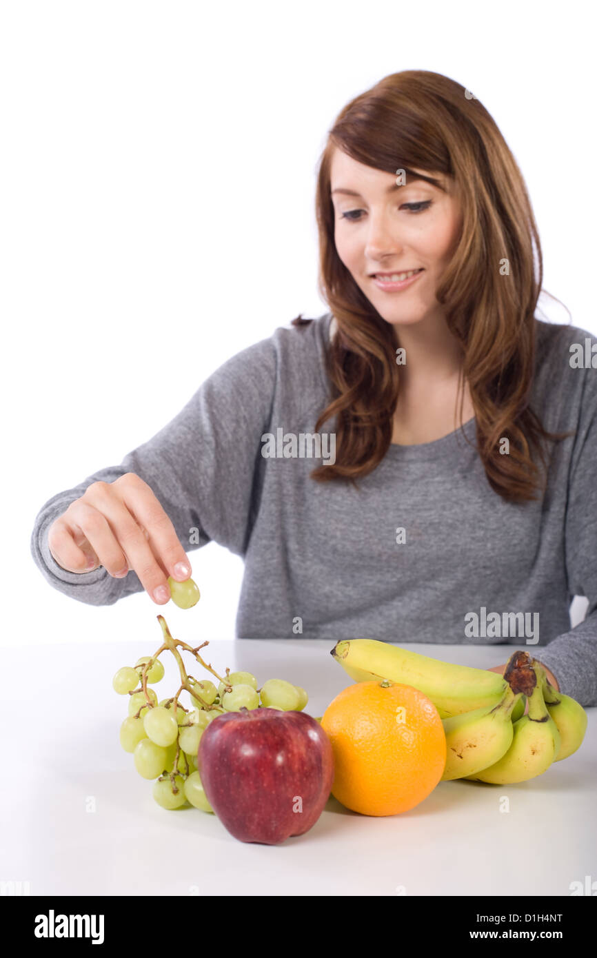 Woman Eating Fresh Fruit Isolated on White Stock Photo - Alamy