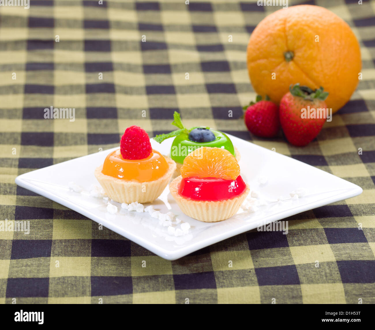 Orange raspberry and blueberry cupcake Stock Photo - Alamy
