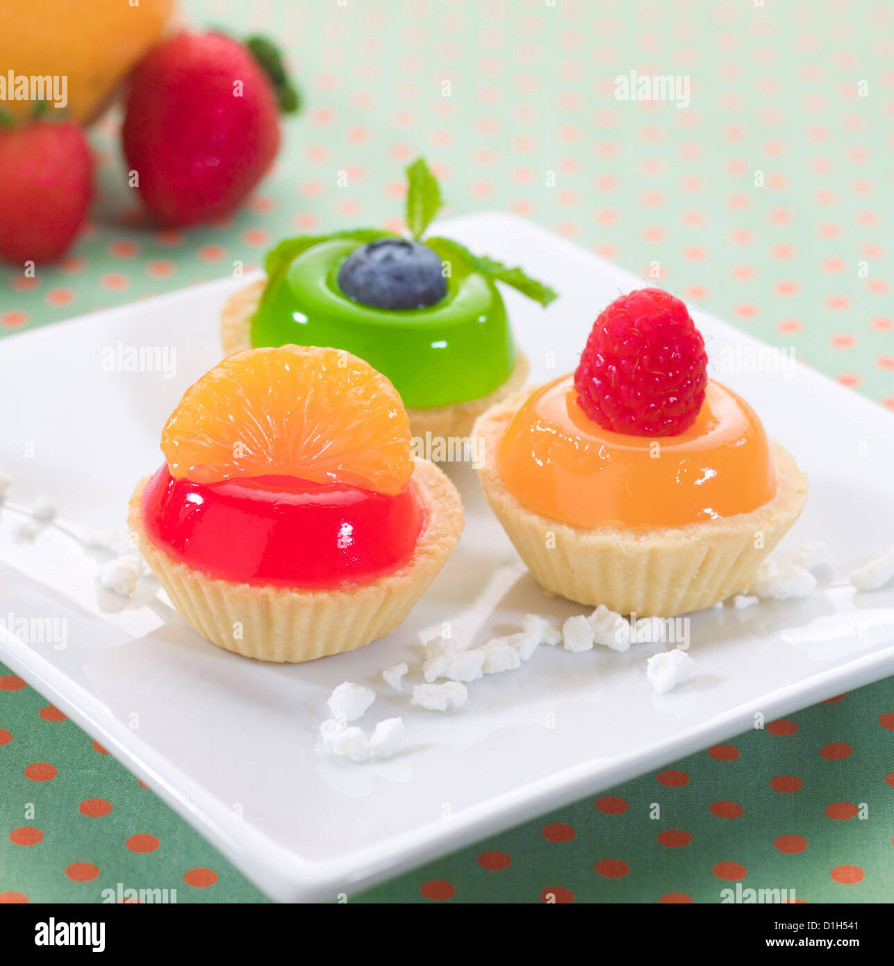Orange raspberry and blueberry cupcake Stock Photo - Alamy