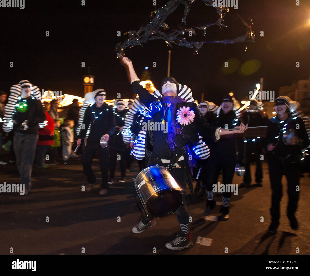The parade reaches Madeira Drive. Burning the Clocks Lantern lit ...
