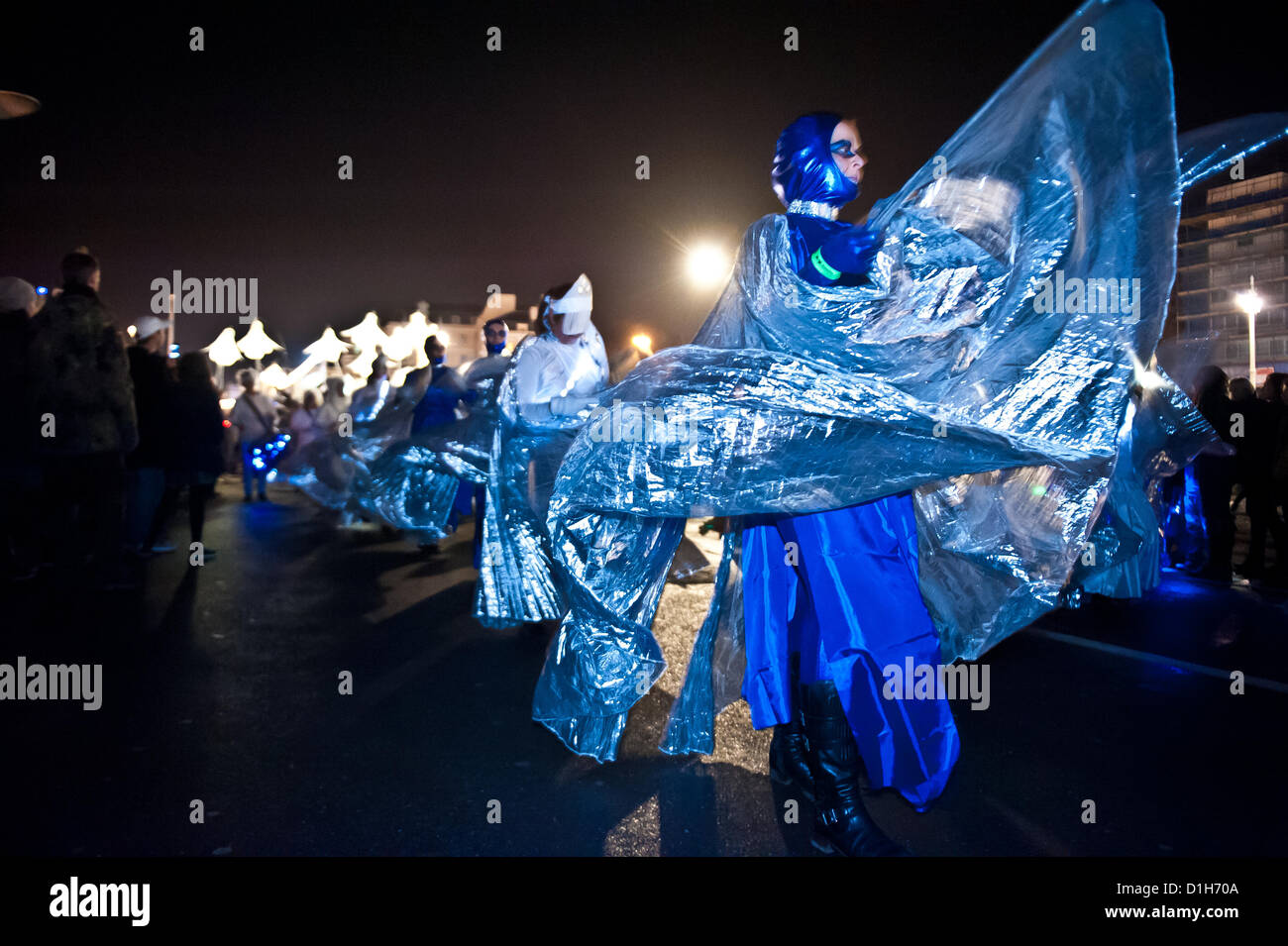 The parade reaches Madeira Drive. Burning the Clocks Lantern lit ...