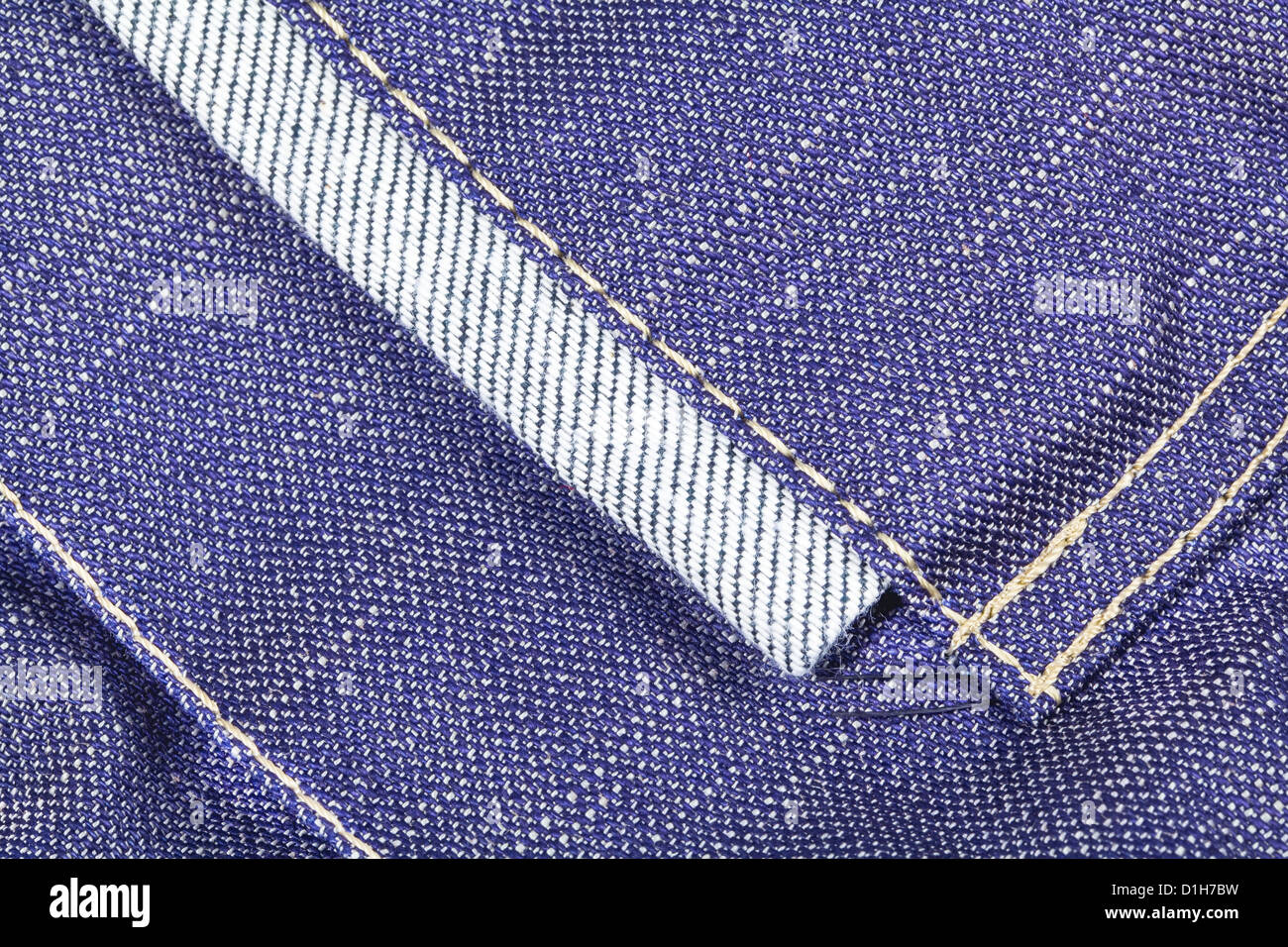 Denim fabric texture with seams close view Stock Photo - Alamy