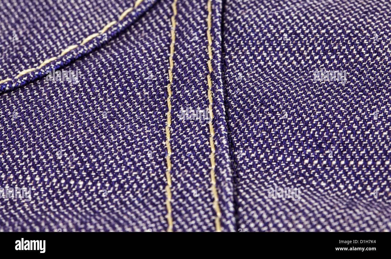Jeans textile background with close view on seams Stock Photo - Alamy