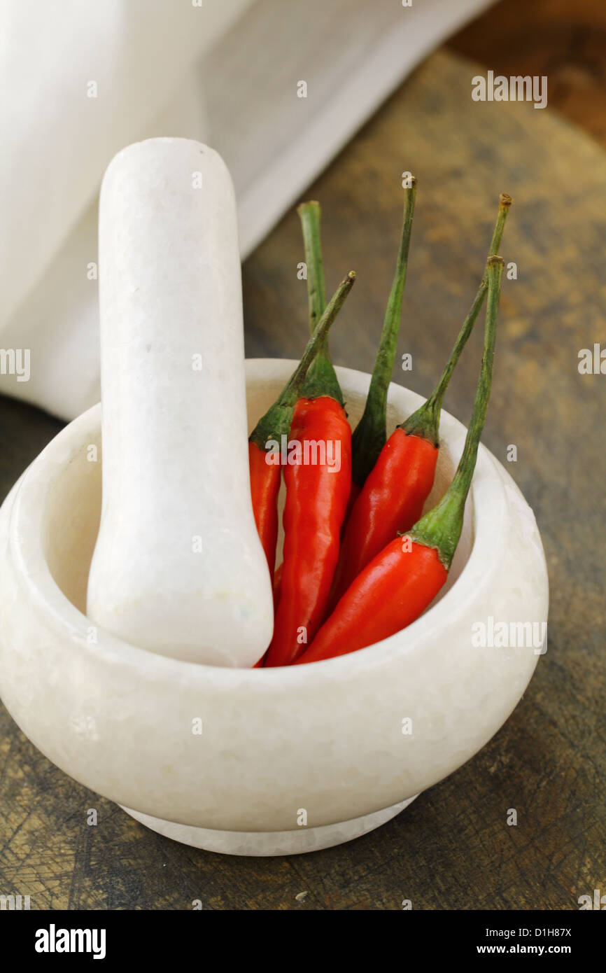 red hot chili peppers in a marble mortar Stock Photo - Alamy