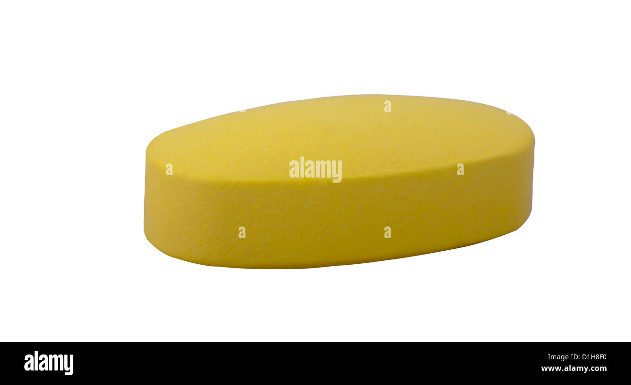 Yellow pill isolated on white background Stock Photo - Alamy