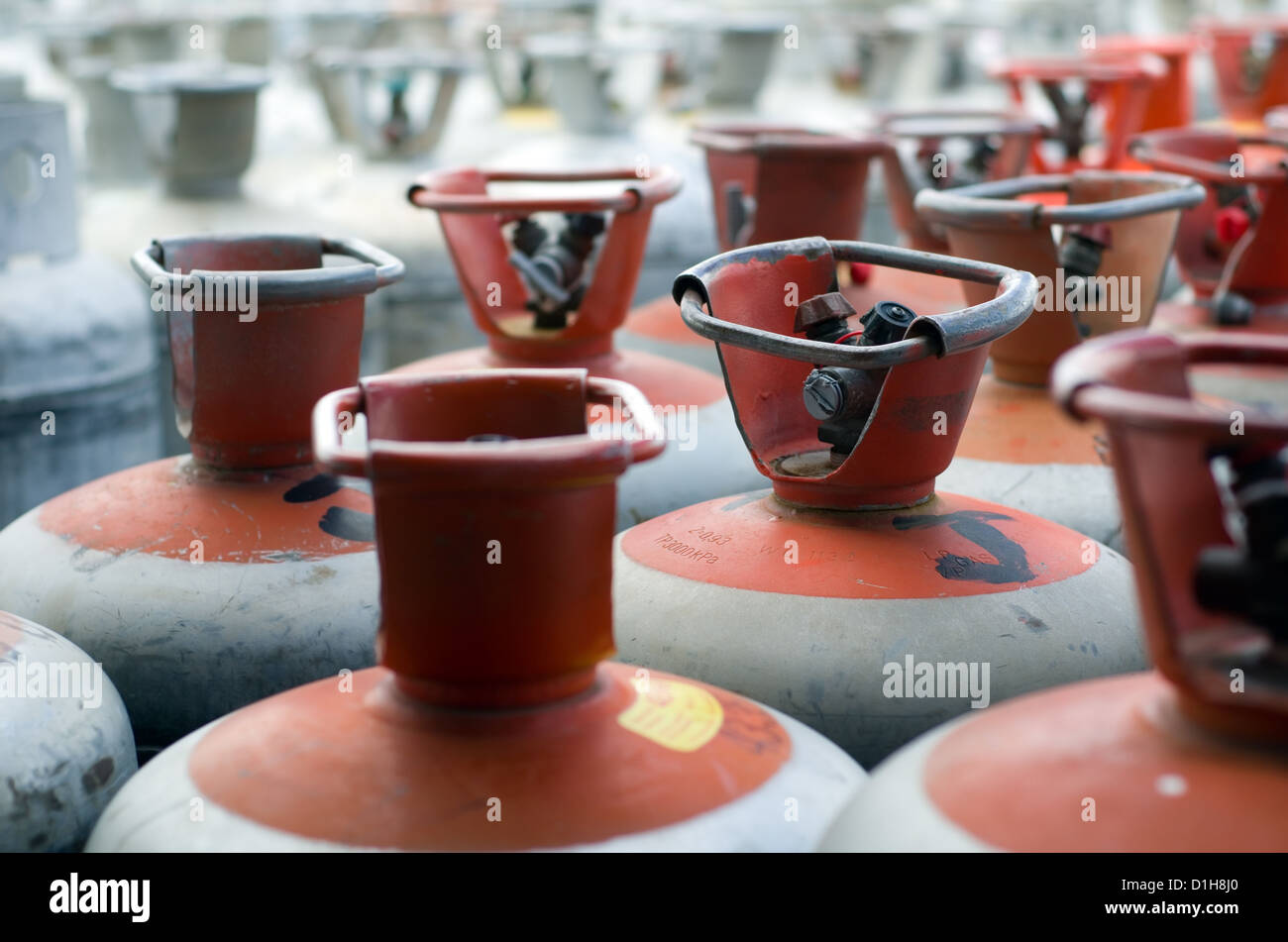 Metal LPG gas bottles in storage Stock Photo - Alamy