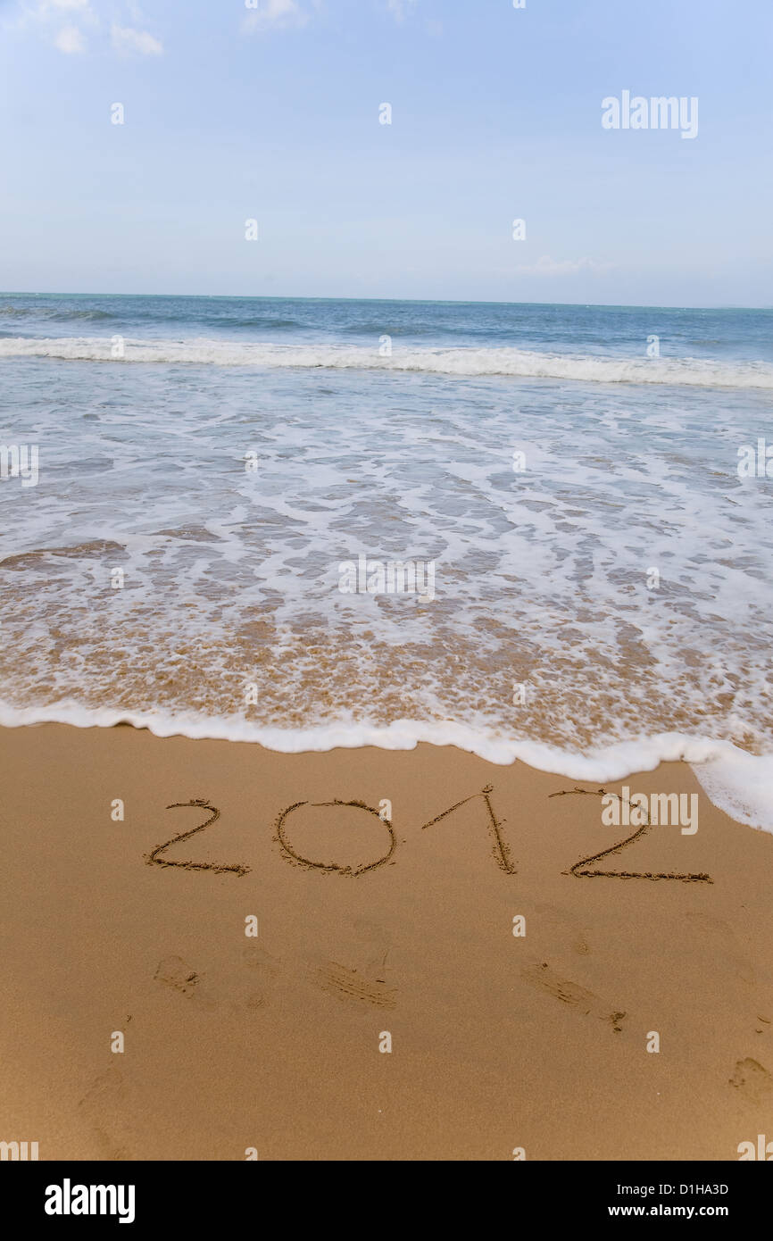 new 2012 year numbers drawings in the sand on the beach Stock Photo - Alamy