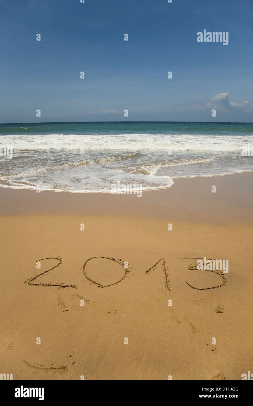 new 2013 year numbers drawings in the sand on the beach Stock Photo - Alamy