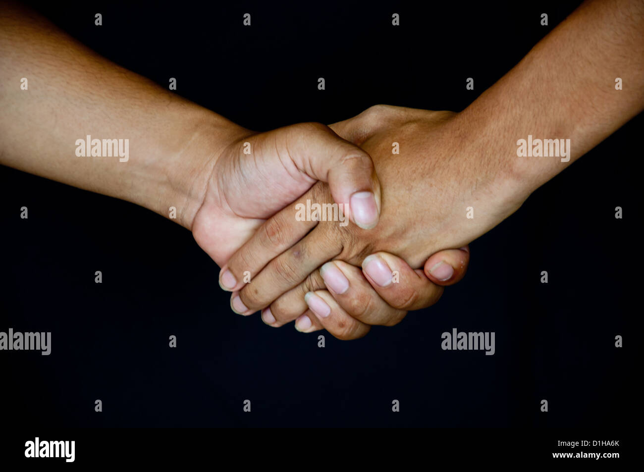 handshake on black background Stock Photo - Alamy