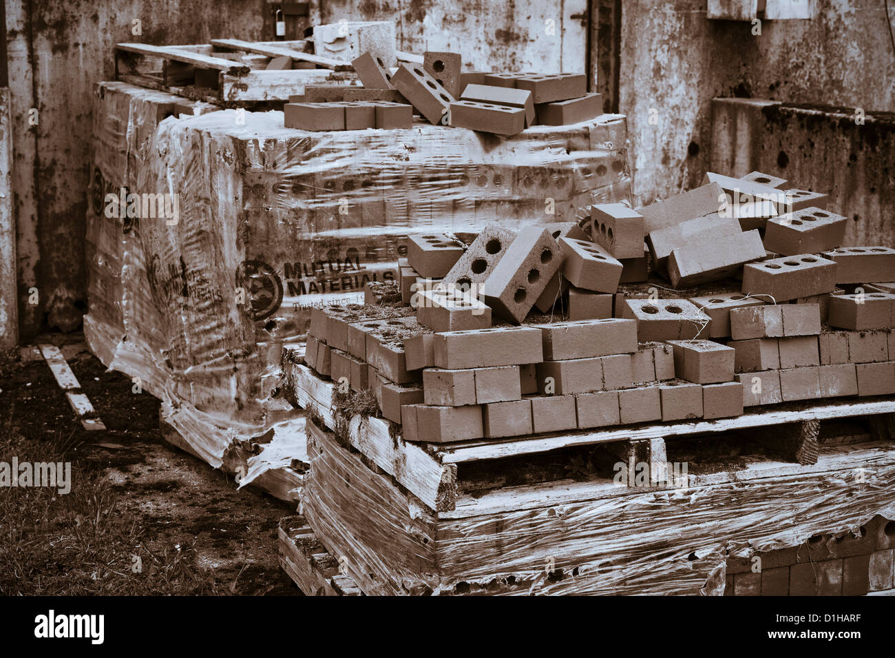 New bricks stacked on pallets outside old World War II US Navy base ...