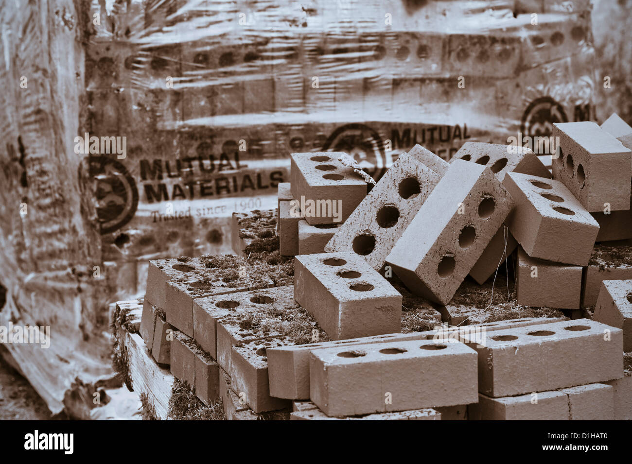 New bricks stacked on pallets outside old World War II US Navy base ...