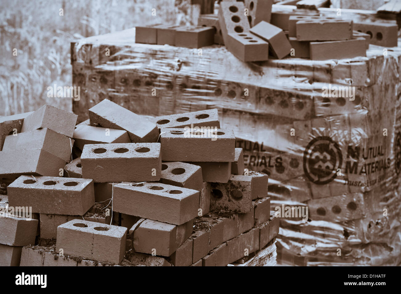 New bricks stacked on pallets outside old World War II US Navy base ...