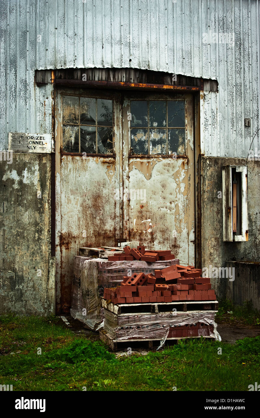 New bricks stacked on pallets outside old World War II US Navy base ...